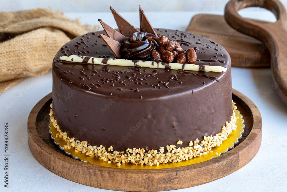 Chocolate birthday cake on a white background. Cake with croquant and ...