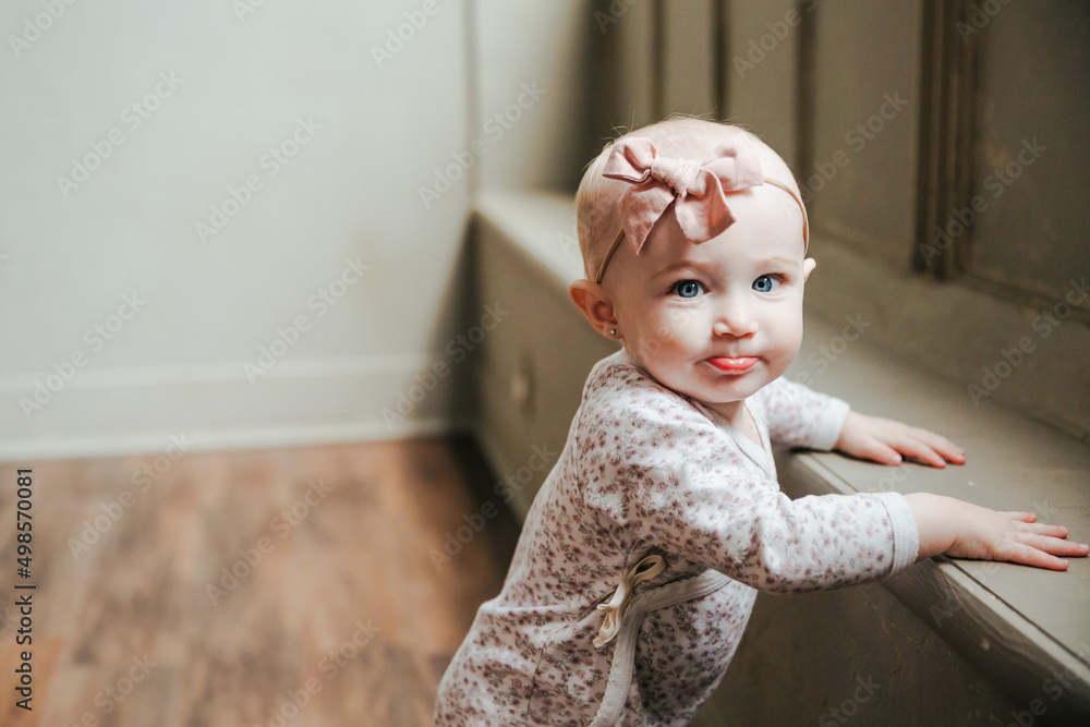 baby girl learning to stand Stock Photo | Adobe Stock