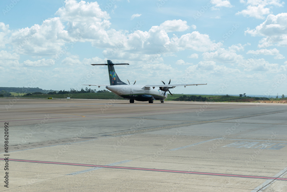 back view of ATR-72 model turboprop passenger plane parking at the ...