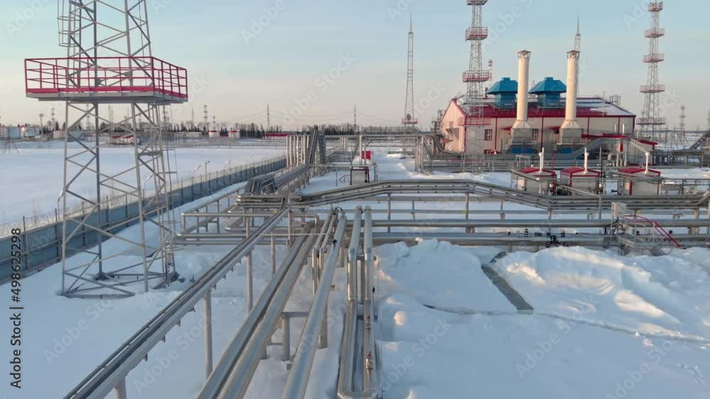 Winter oil and gas refinery plant in siberia. The drone flies over the ...