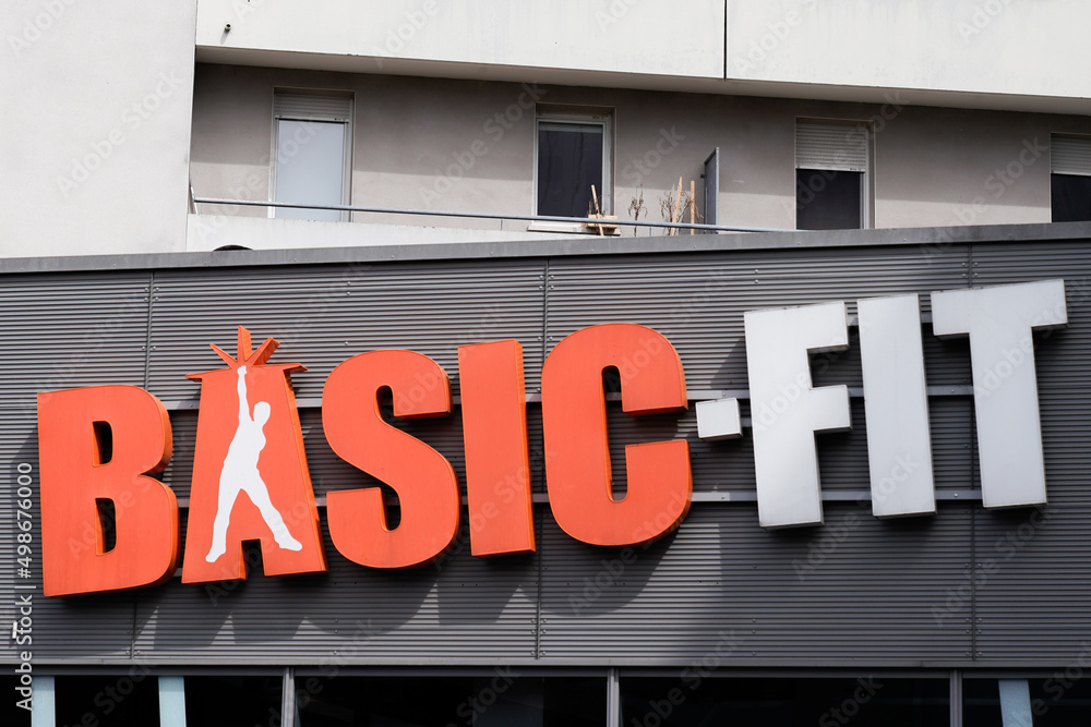 Basic-Fit fitness club brand sign text and logo front of sporty center ...