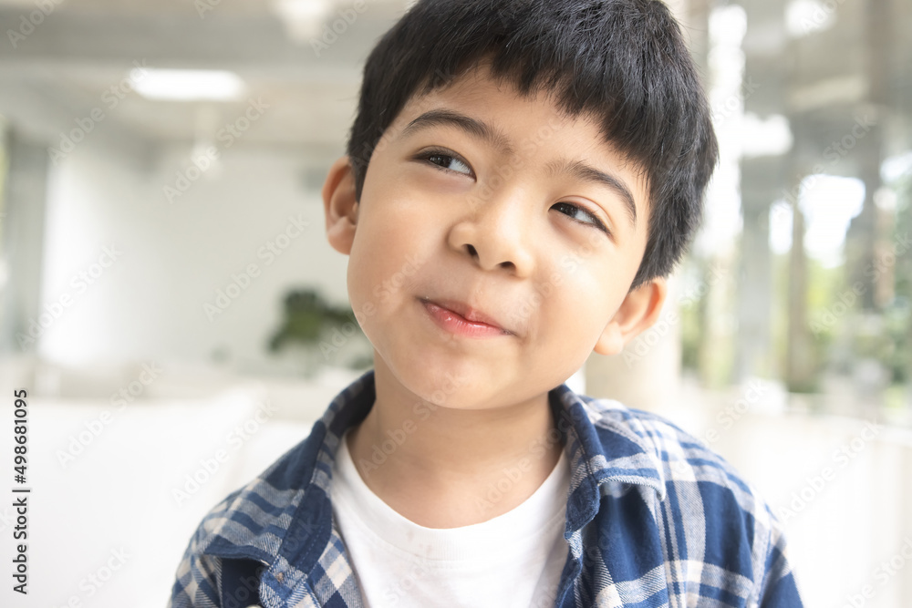 Happy Little Asian boy showing front teeth with big smile and laugh ...