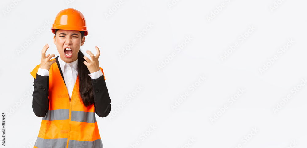 Mad and outraged asian female chief engineer, construction manager ...