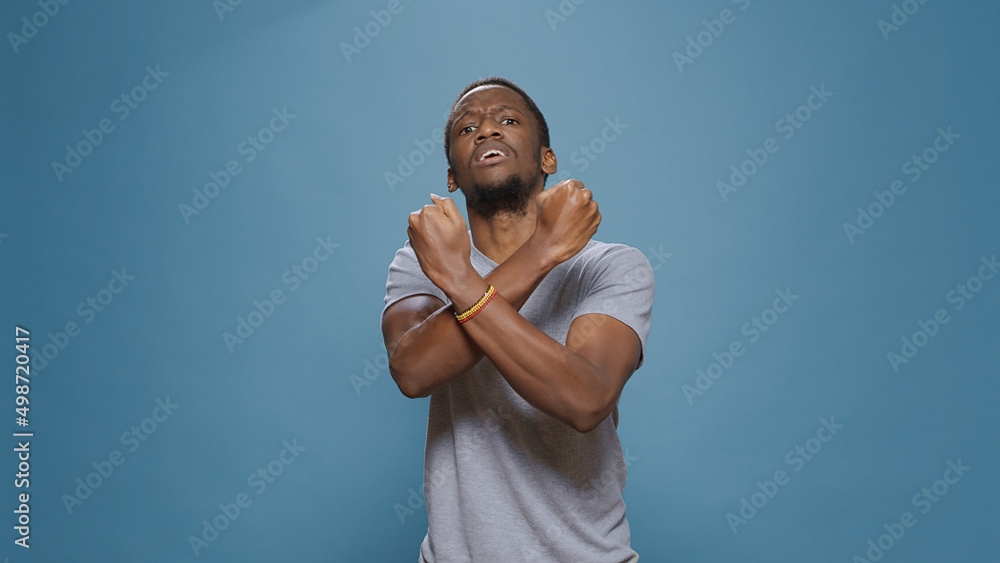 Displeased person showing disapproval and stop sign with arms, doing ...