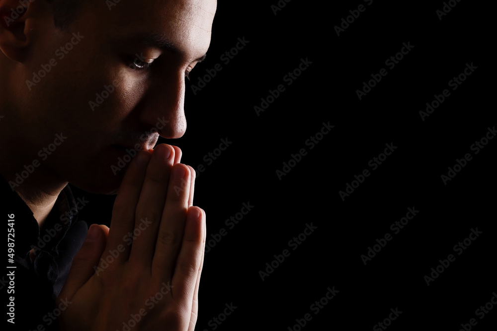 prayer on a dark background Stock Photo | Adobe Stock