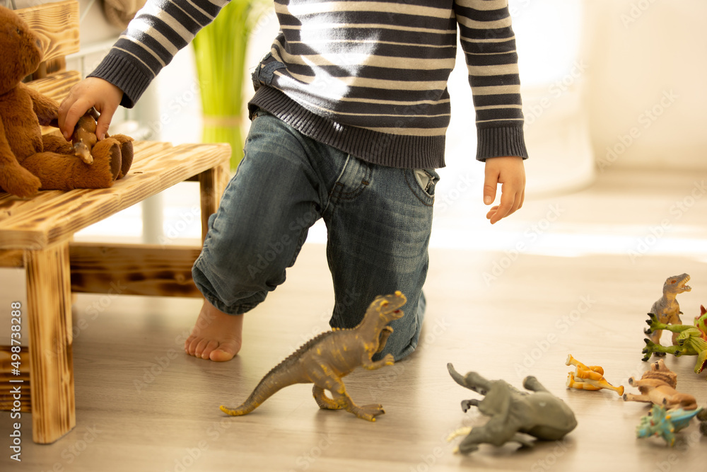 Little toddler child, boy, pee in his pants while playing with toys ...