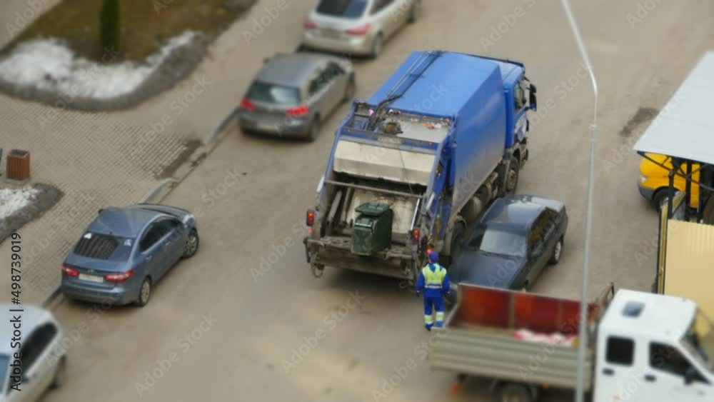City garbage truck takes out household waste time lapse top view Stock ...