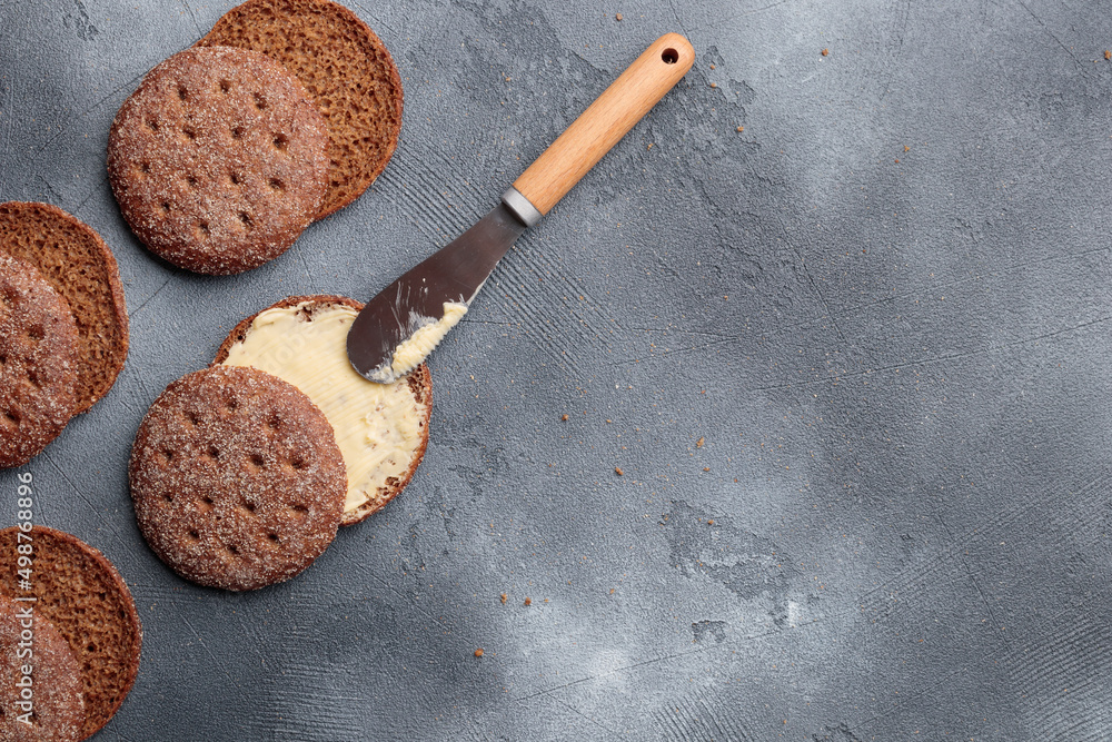 Ruisleipa - traditional Finnish rye bread with butter on a gray ...