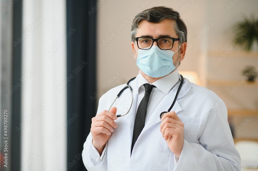 Mature old medical healthcare professional doctor wearing white coat ...
