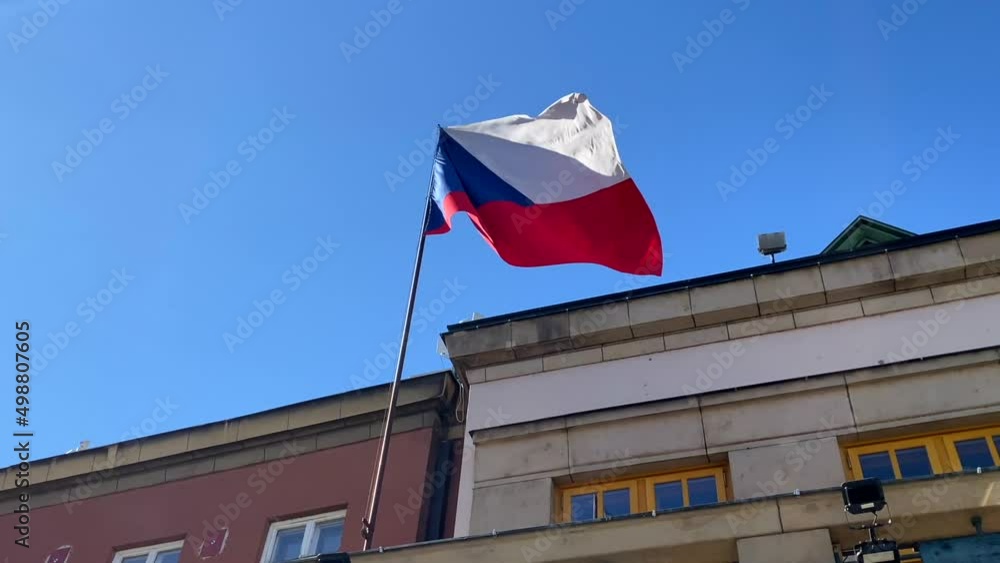 Czech flag hoisted at the town hall. The flag flutters in the wind ...