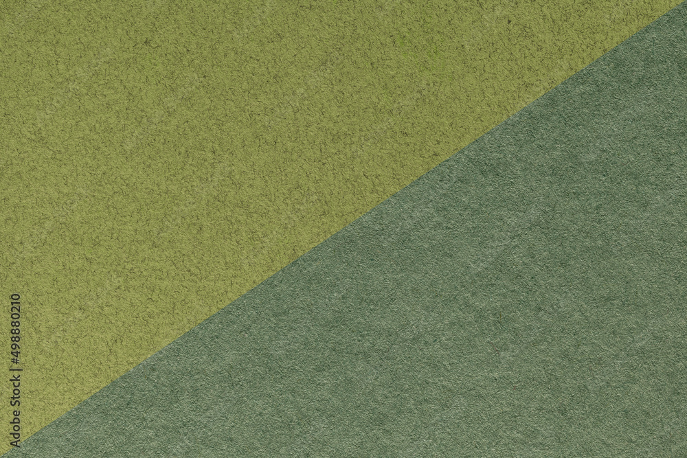 Texture of craft green and olive paper background, half two colors ...