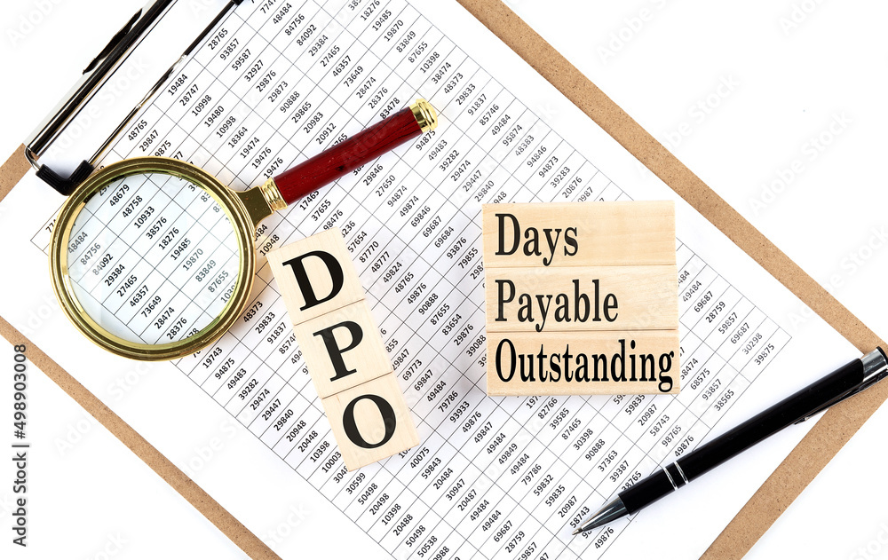DPO - Days Payable Outstanding text on wooden block on chart background ...