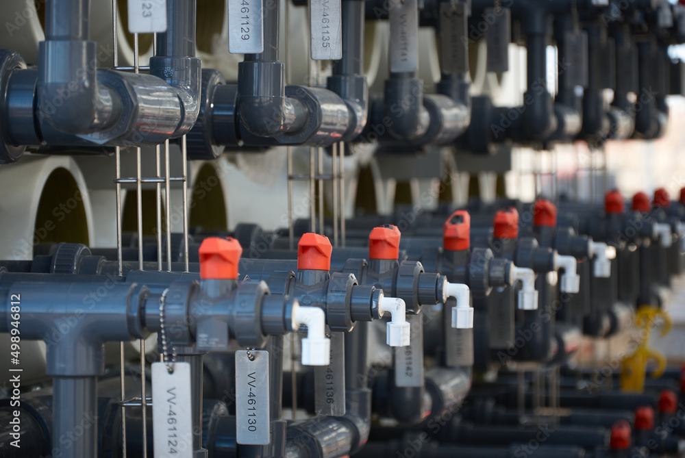 Row of hand operated valves on a water treatment system Stock Photo ...