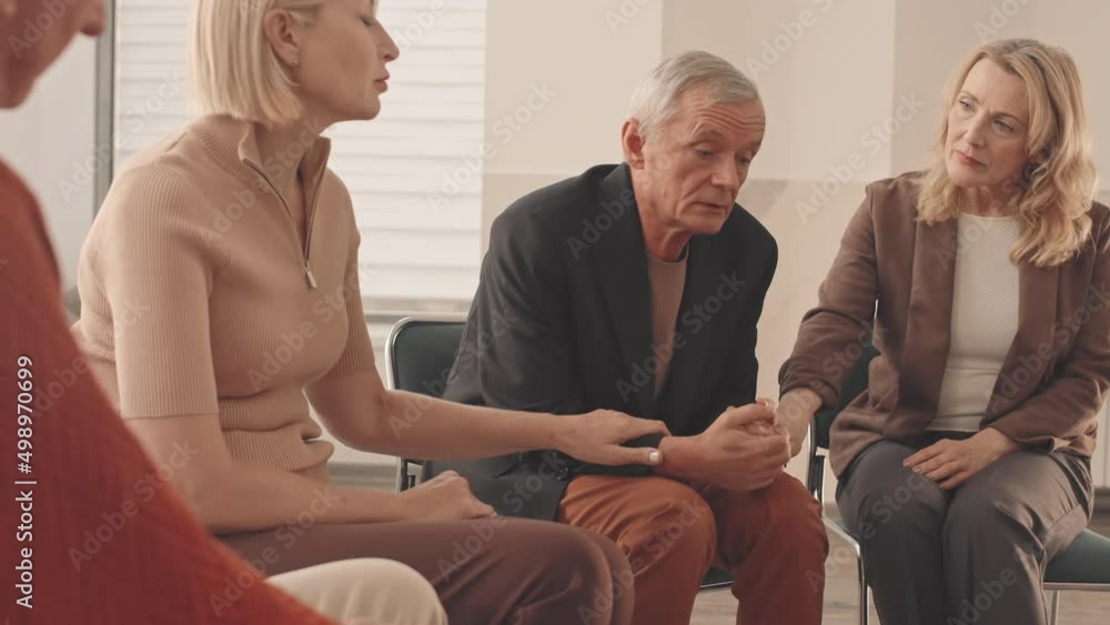 Medium slowmo of Caucasian senior man with depression seeking for ...