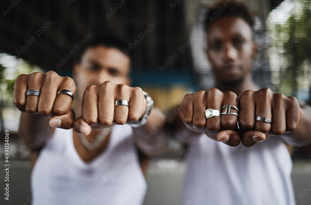 Kiss the ring. Closeup shot of two male gangsters hands showing off ...