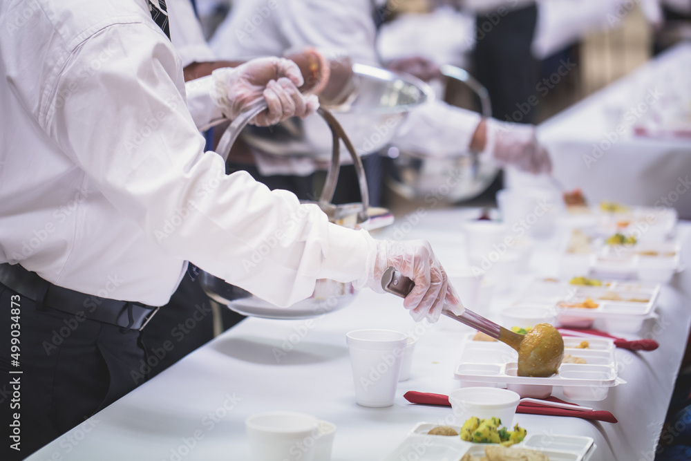Serving Indian food in a Hindu temple close ups Stock Photo | Adobe Stock