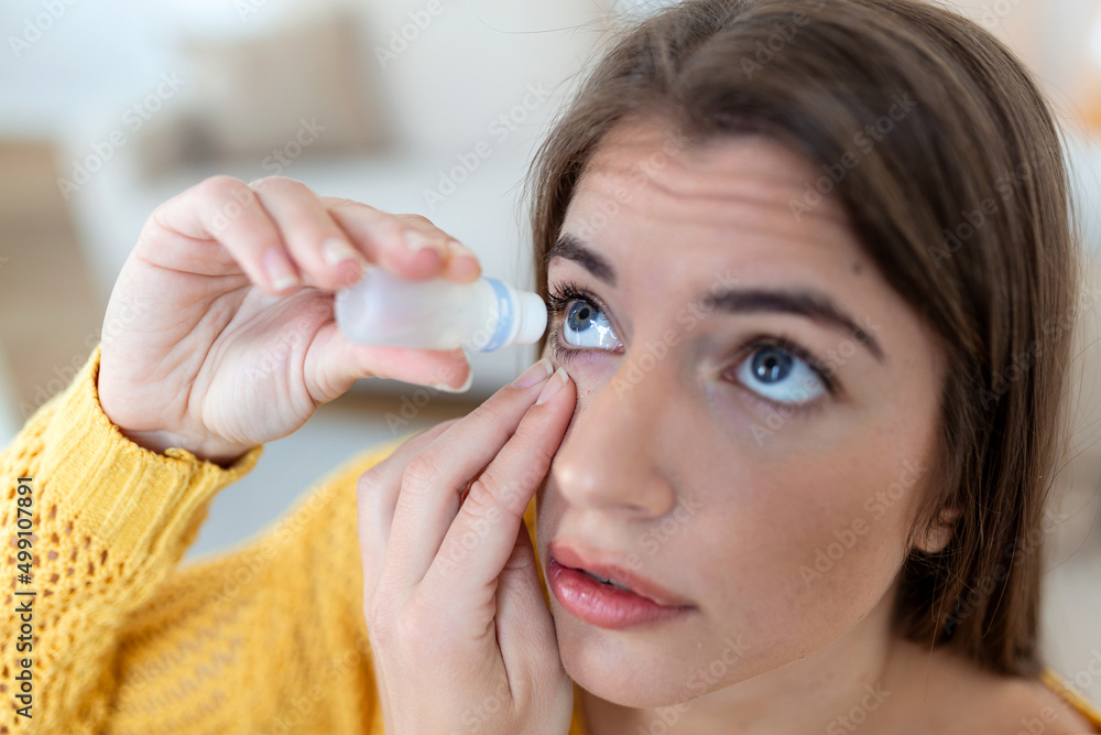 Woman using eye drop, woman dropping eye lubricant to treat dry eye or ...