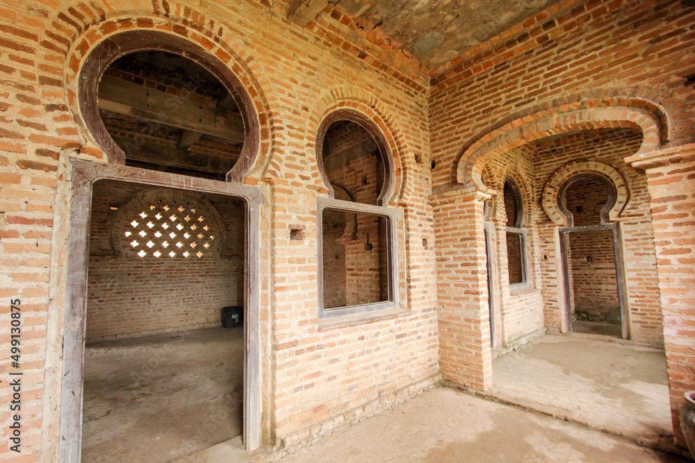 Bare door frames and masonry of brick walls inside the unfinished ...