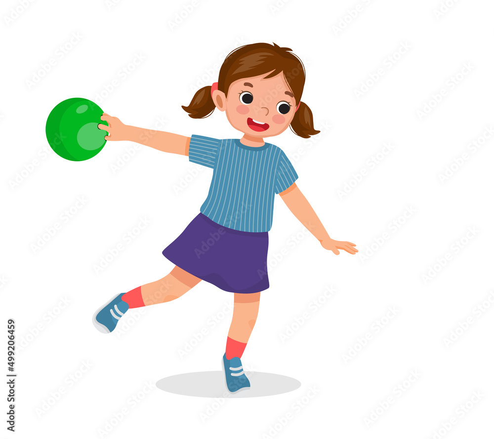 happy little girl playing bowling in the sport club ready to throw the ...