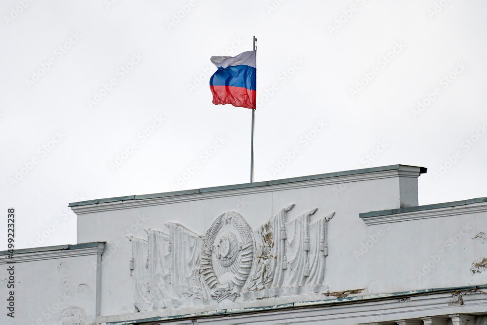 russian flag on top of building in moscow city russia against blue sky ...