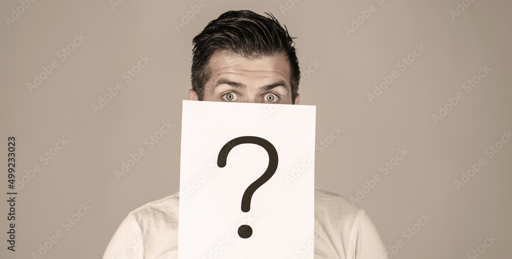 Foto de Man a question. Doubtful man holding Question Mark. Problems ...