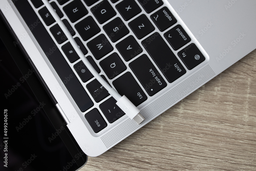 USB Type-C cable with laptop USB C ports close up. Top view Stock Photo ...