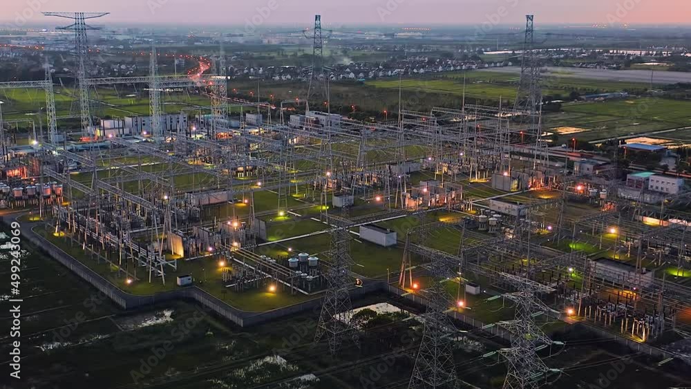 Aerial footage of high voltage power tower in substation. Transmission ...