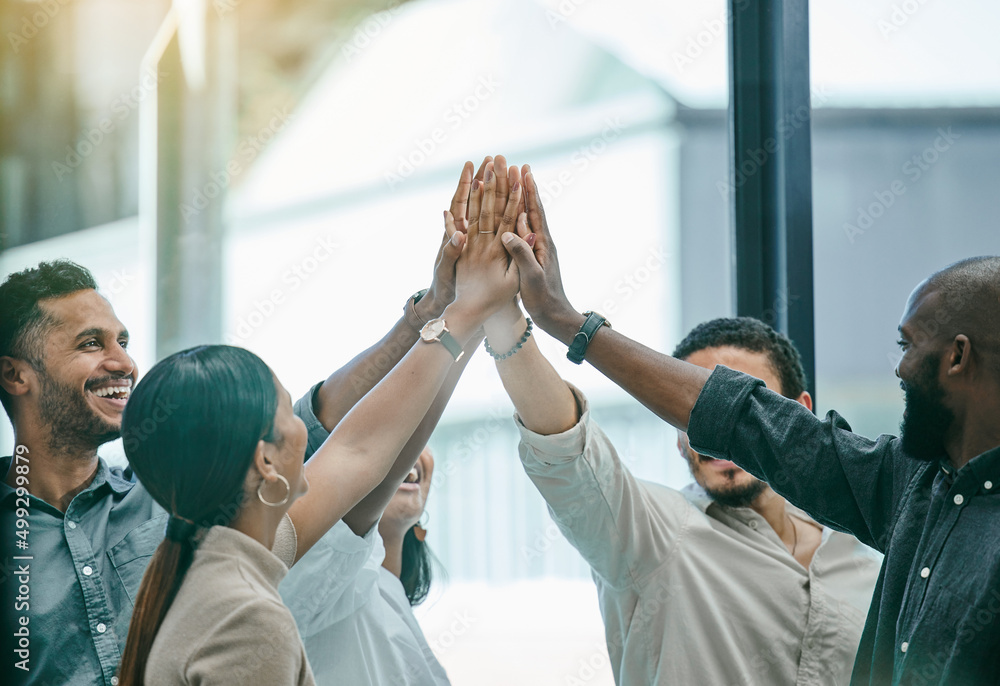 Im so proud of this team. Shot of a group of coworkers high fiving each other. | Uwalls.co.uk