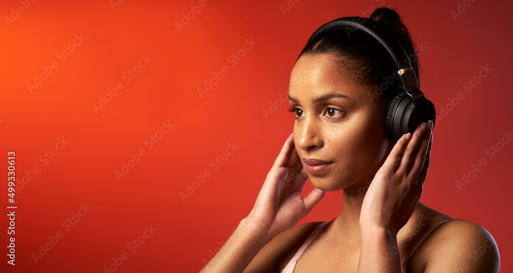 Good beats help me keep the pace of my workouts. Studio shot of a ...