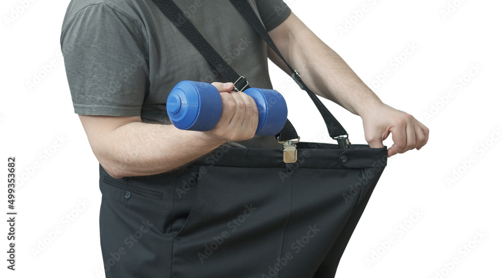 Foto de The man pulls down his pants at the waist and lifts the ...