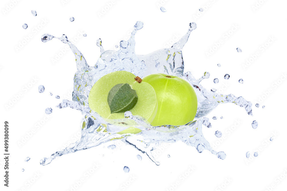 Indian gooseberry (Amla) in water splash isolated on white background ...