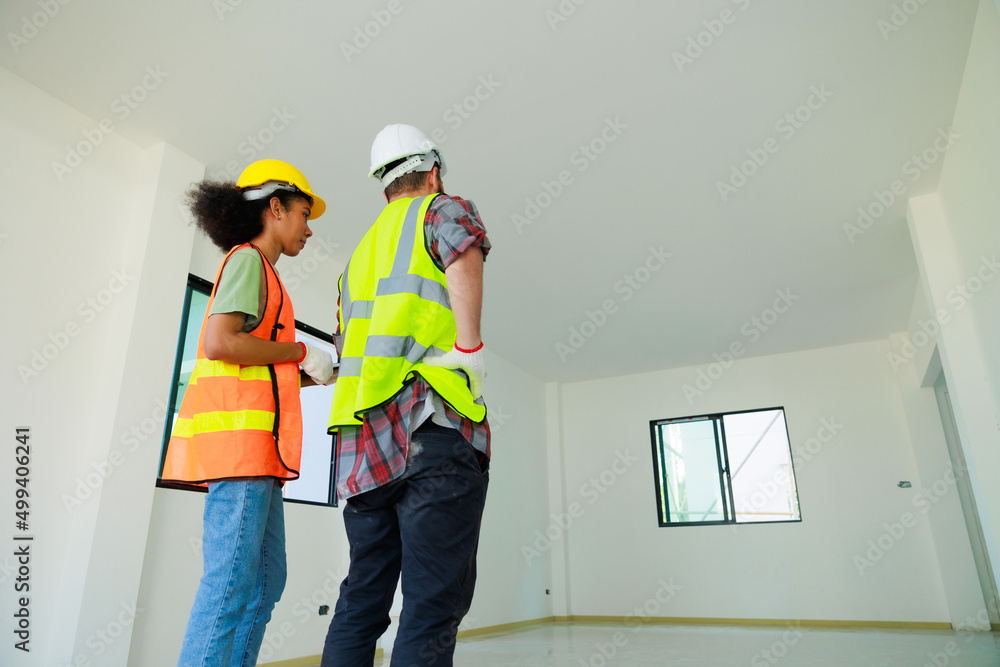 Back view Professional woman and man worker. African American mixed ...