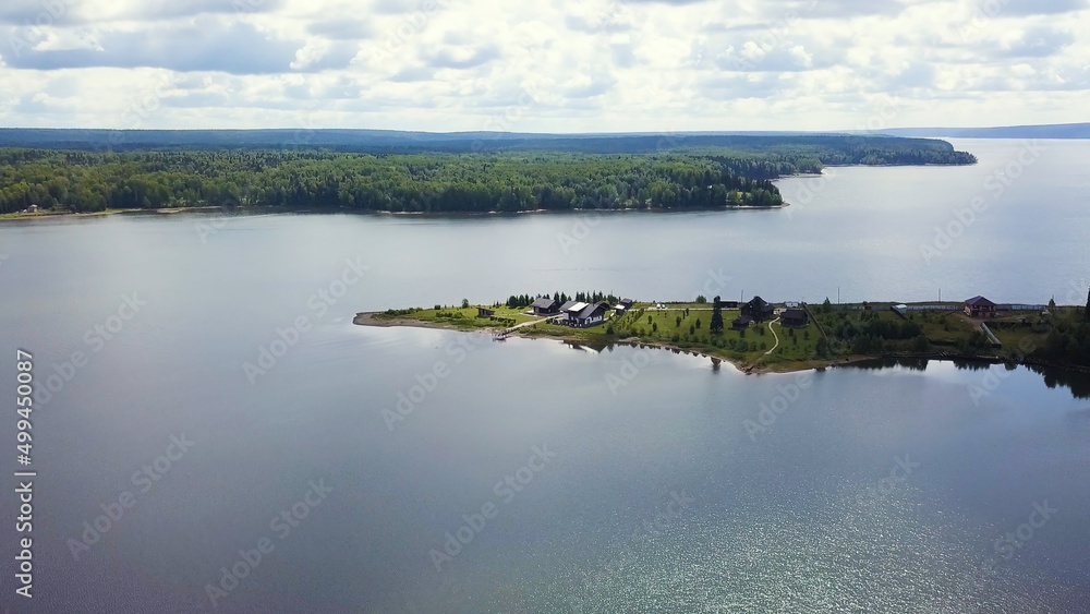 Bird's-eye view.Clip . A huge lake against a background of green forest ...