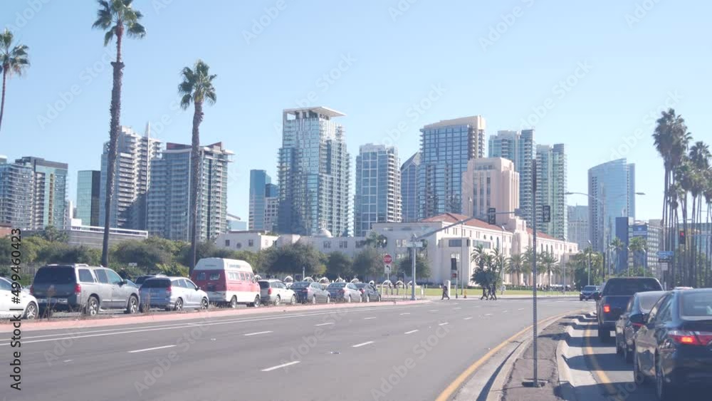 Cars and palm trees on waterfront Harbor drive, highrise skyscrapers in ...