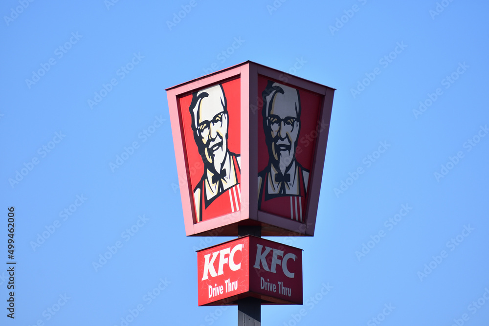 KFC (Kentucky Fried Chicken) signage, logo, emblem on the pole at Drive ...