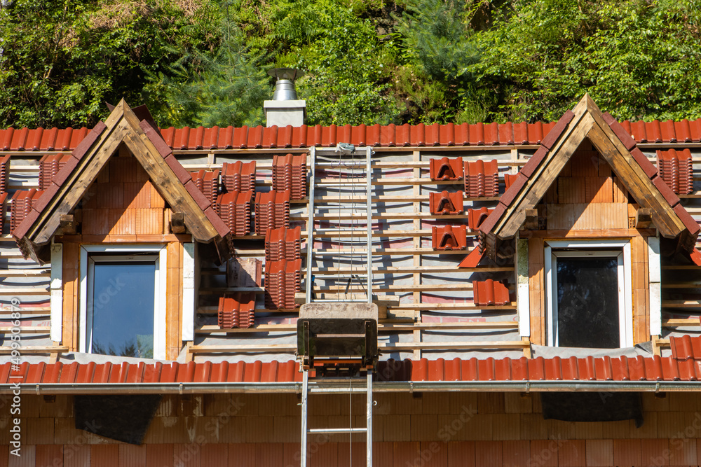 Concrete tiles with a lift ready for installation on the roof of house ...