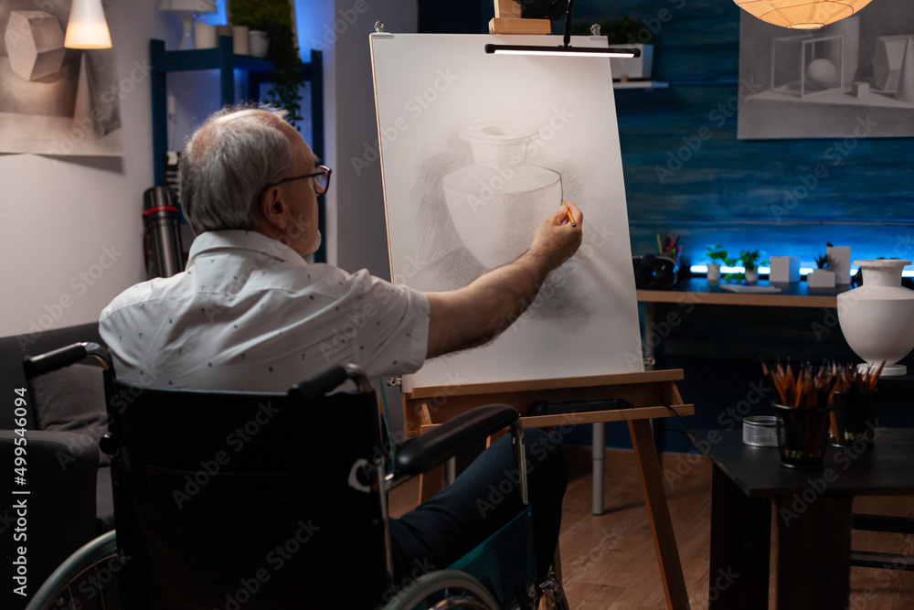 Senior man artist using wheelchair drawing original pencil drawing of ...