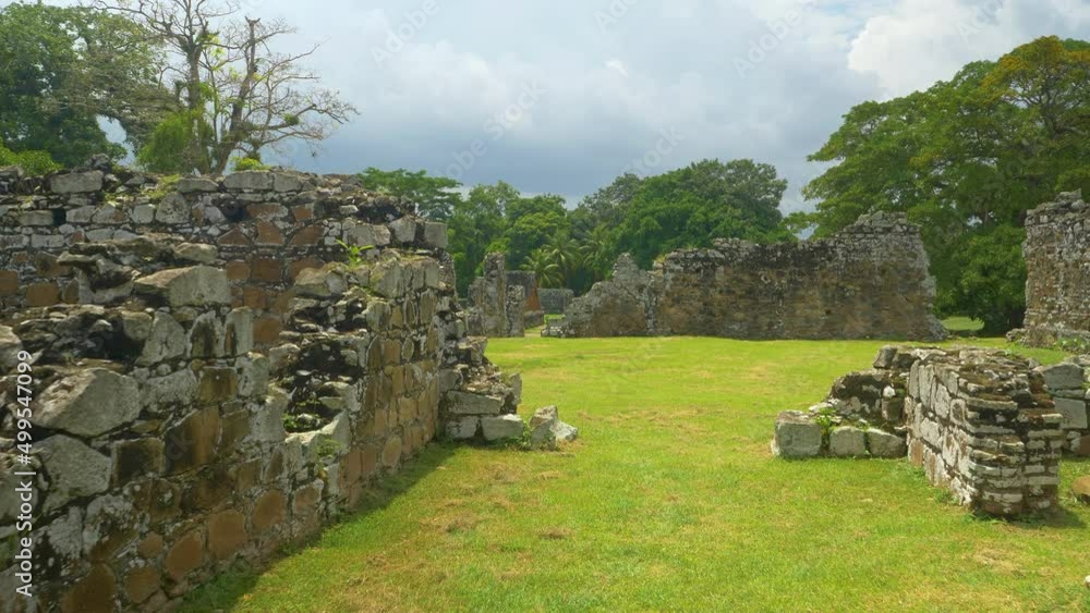 Walking between the decaying buildings of Old Panama settlement on a ...