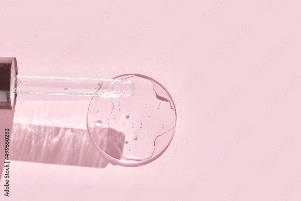 Serum gel texture swatch. Transparent drop with golden sparkles. Pink ...