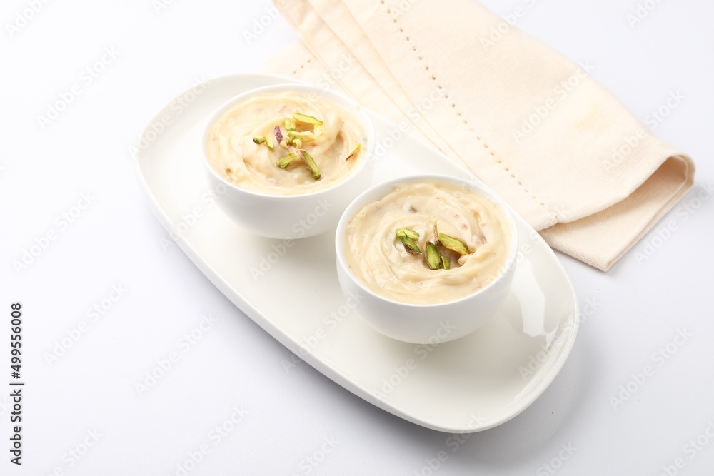 Shrikhand is an Indian sweet dish made of strained curd,garnished with ...