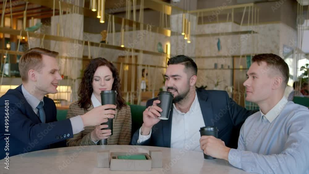 Multi-ethnic friends laughing having fun at meeting in coffeehouse ...