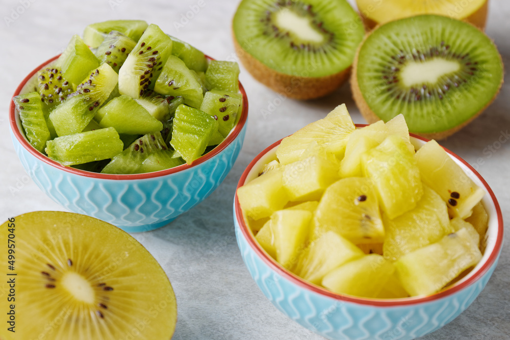 Kiwifruit of different types colors: green kiwi fruit and golden yellow ...