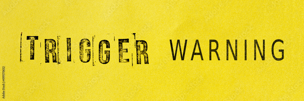 Trigger warning sign message on yellow background. Stamp letters mental ...