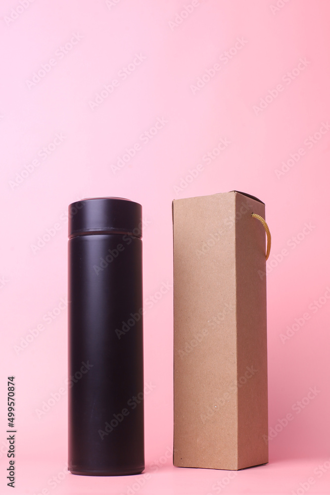 Tumbler box with black thermos tumbler isolated on pink background ...