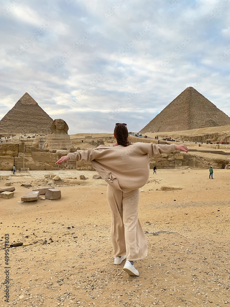 Young happy woman tourist in front of the Great Sphinx and Great ...