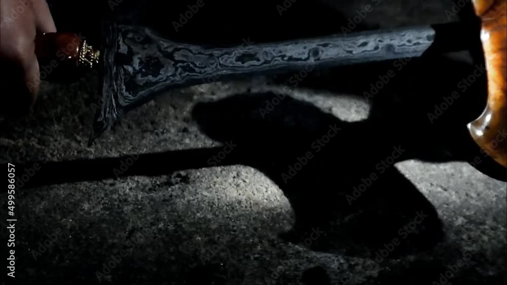 keris craft. A man takes a kris out of its container. Javanese ...