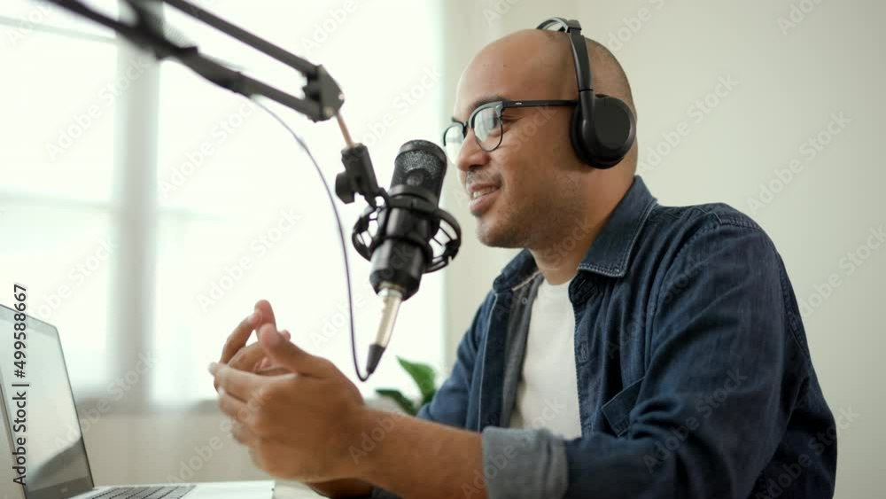 Content creator asia man host streaming his a podcast on laptop with ...