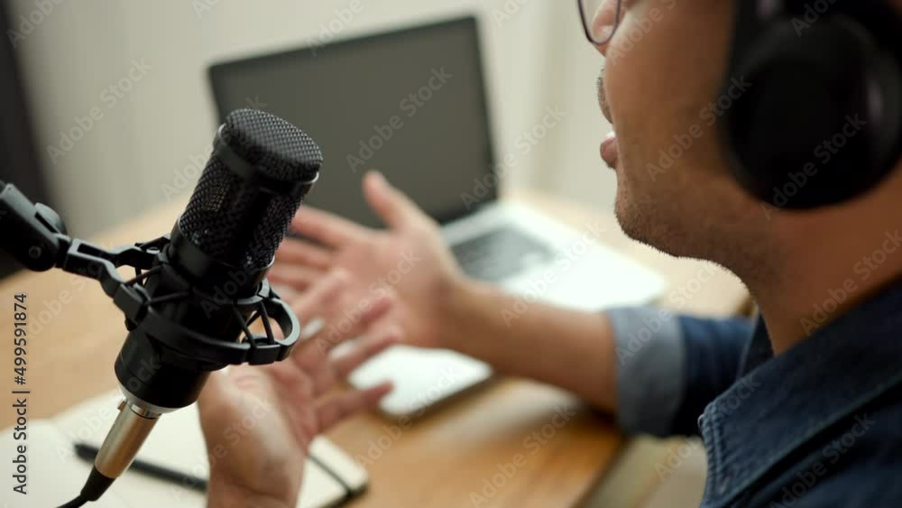 Close-up condenser microphone of content creator man host streaming his ...