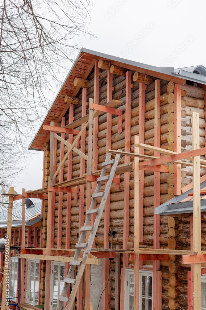 construction of a wooden house from round timber, natural eco-friendly ...