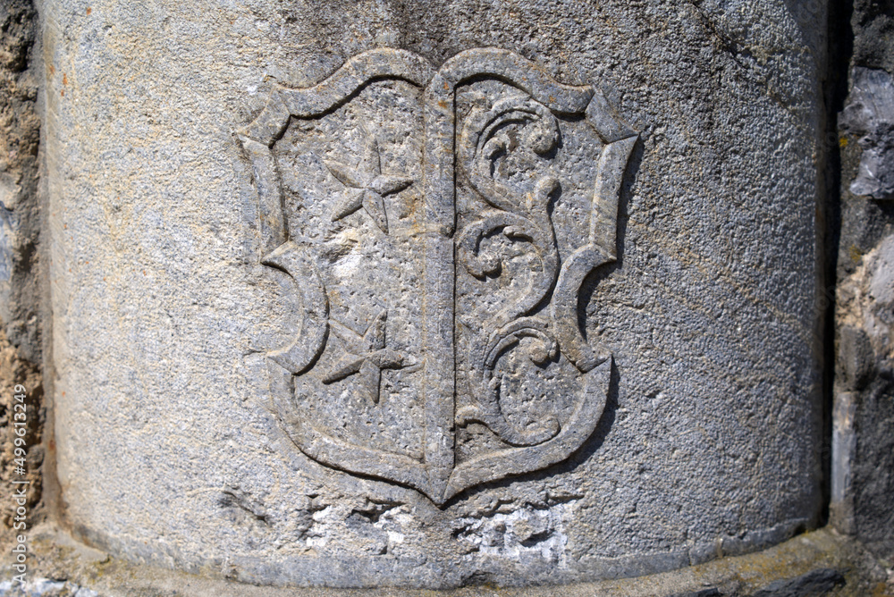 Coat of arms engraved in stone wall at the old town of Sion, Canton ...
